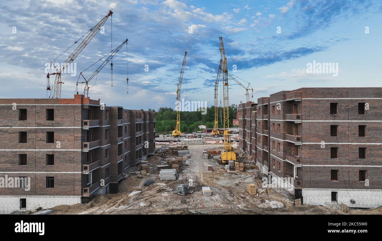 Construction site of low-rise brick houses in summer time Stock Photo ...