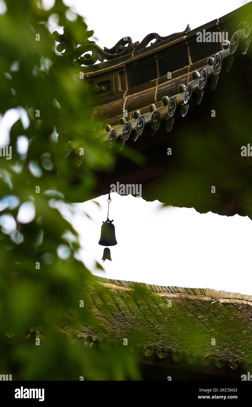 A vertical shot of a bell hanging in the White Cloud Temple (Baiyun Temple) in Beijing, China ...