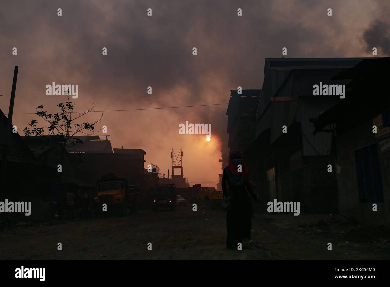 A woman is seen walking at a smog area in Dhaka, Bangladesh on December ...