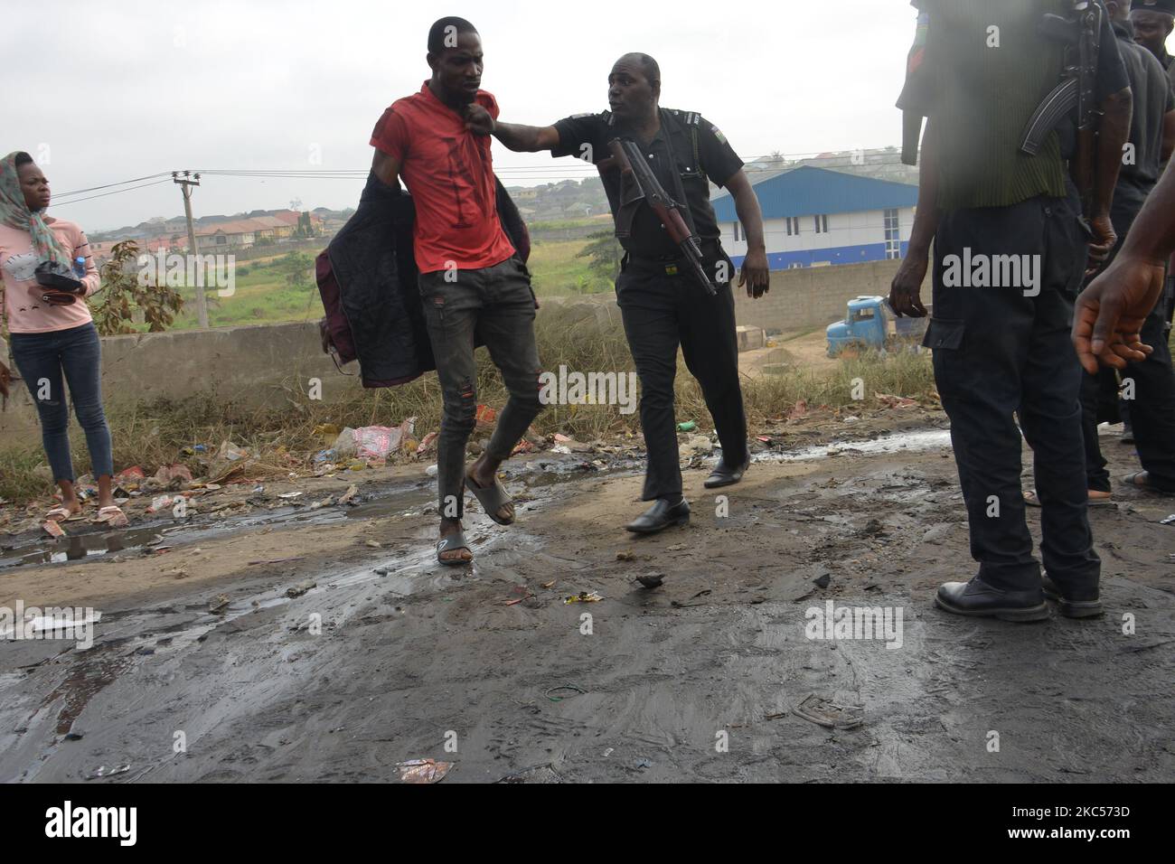 A Man Of The Nigerian Police Force Locked Up A Motorcyclist Okada For