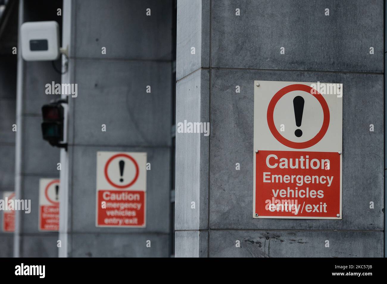 Caution, Emergency Vehicles Entry/Exit signs seen at the entrance to a ...
