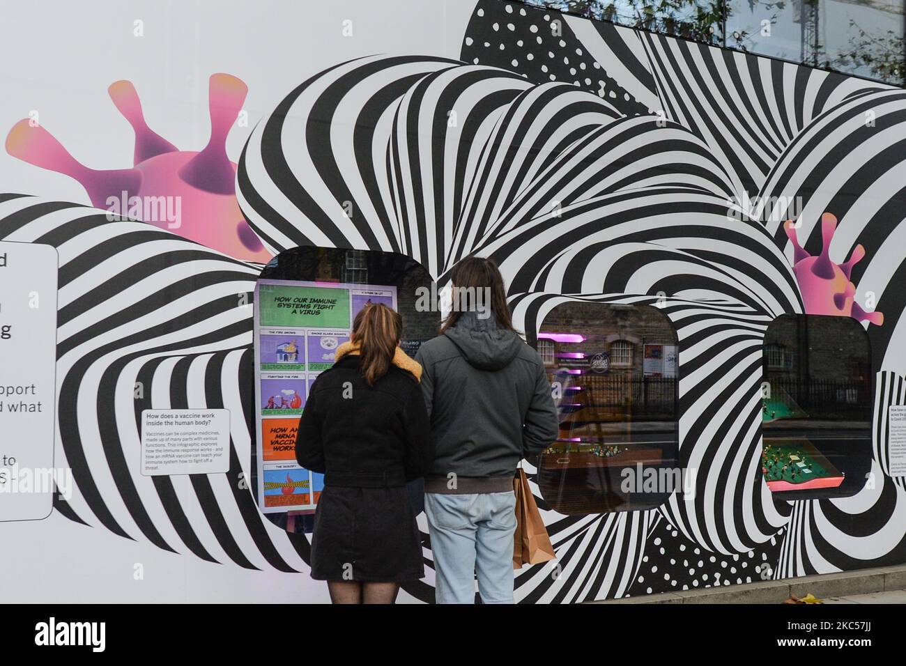 People look at an open air exhibition at the Science Gallery in Dublin ...