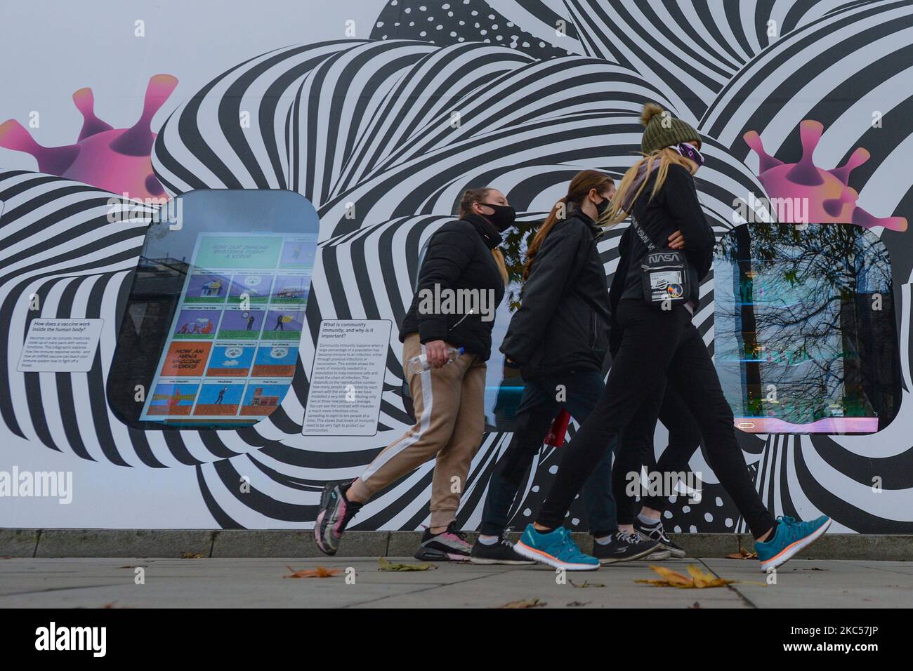 A group of students walk past an open air exhibition at the Science ...