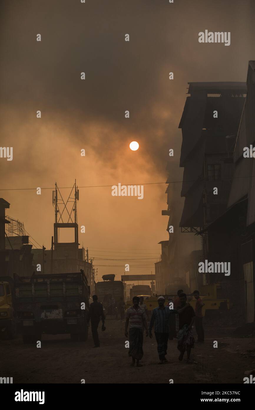 People seen at a smog area in Dhaka, Bangladesh on December 3, 2020 ...