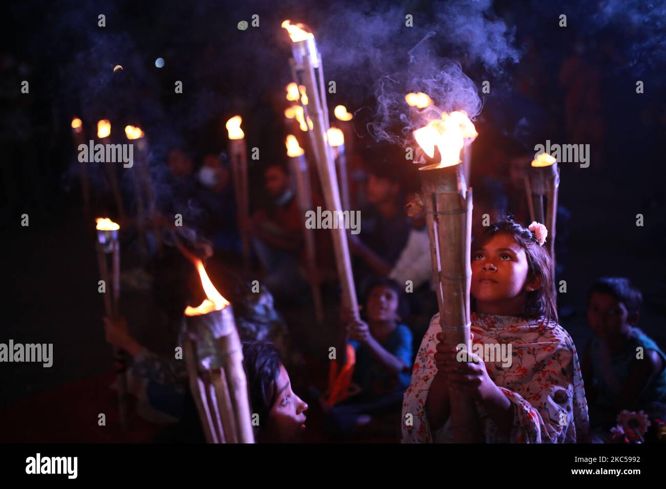 Girls hold torches during an anti-fundamentalism protest in Dhaka ...