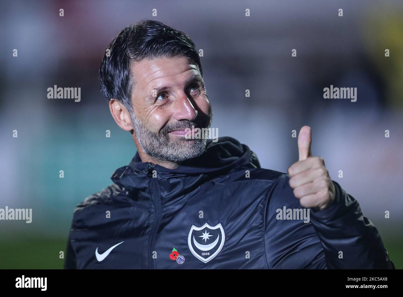 Danny Cowley manager of Portsmouth applauds the travelling fans during ...