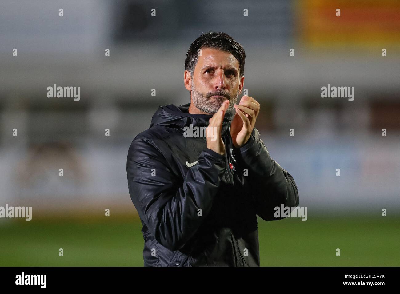 Danny Cowley manager of Portsmouth applauds the travelling fans during ...