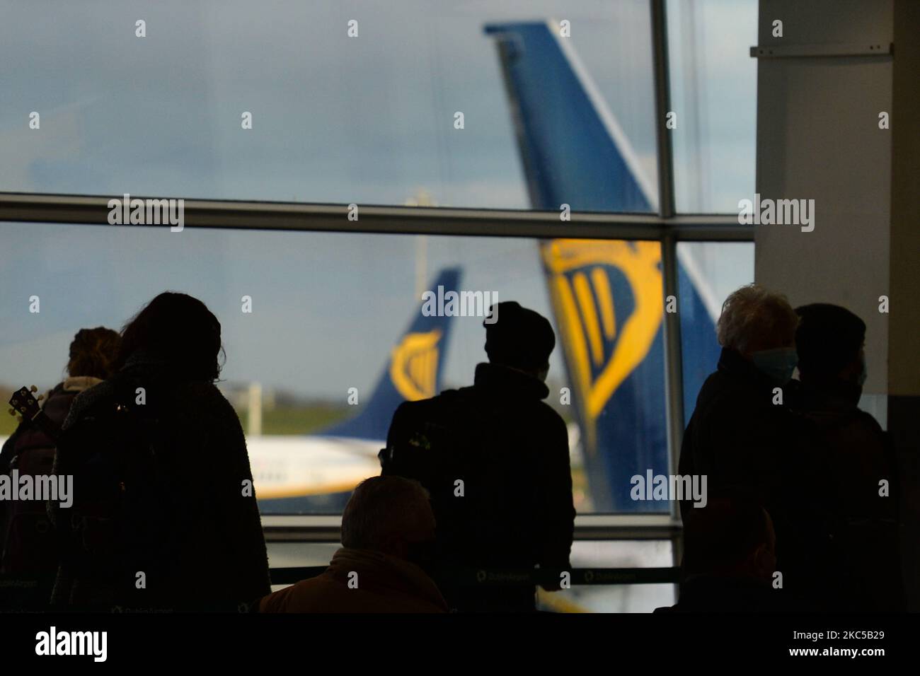 Passengers boarding a Ryanair plane to Katowice at Dublin Airport ...