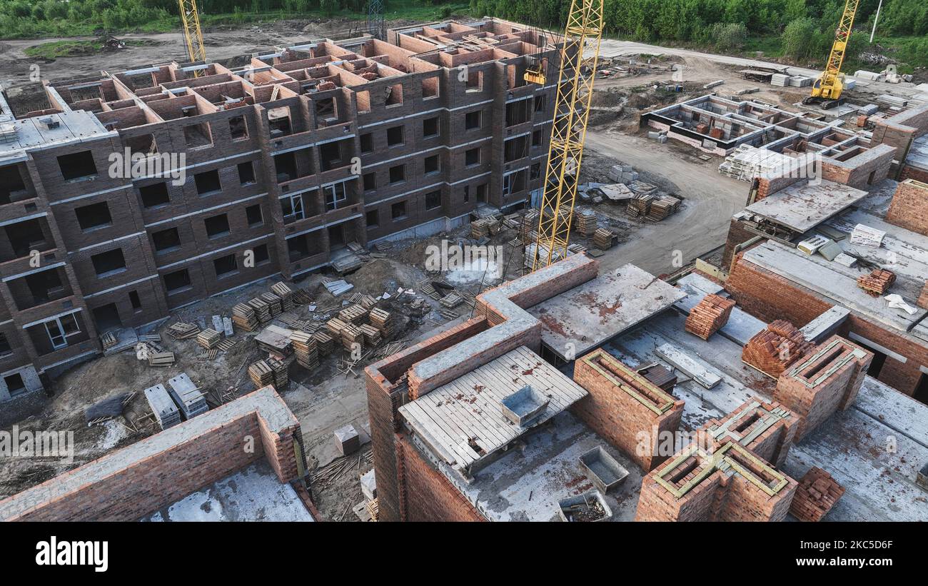 Construction site of low-rise brick houses in summer time Stock Photo ...