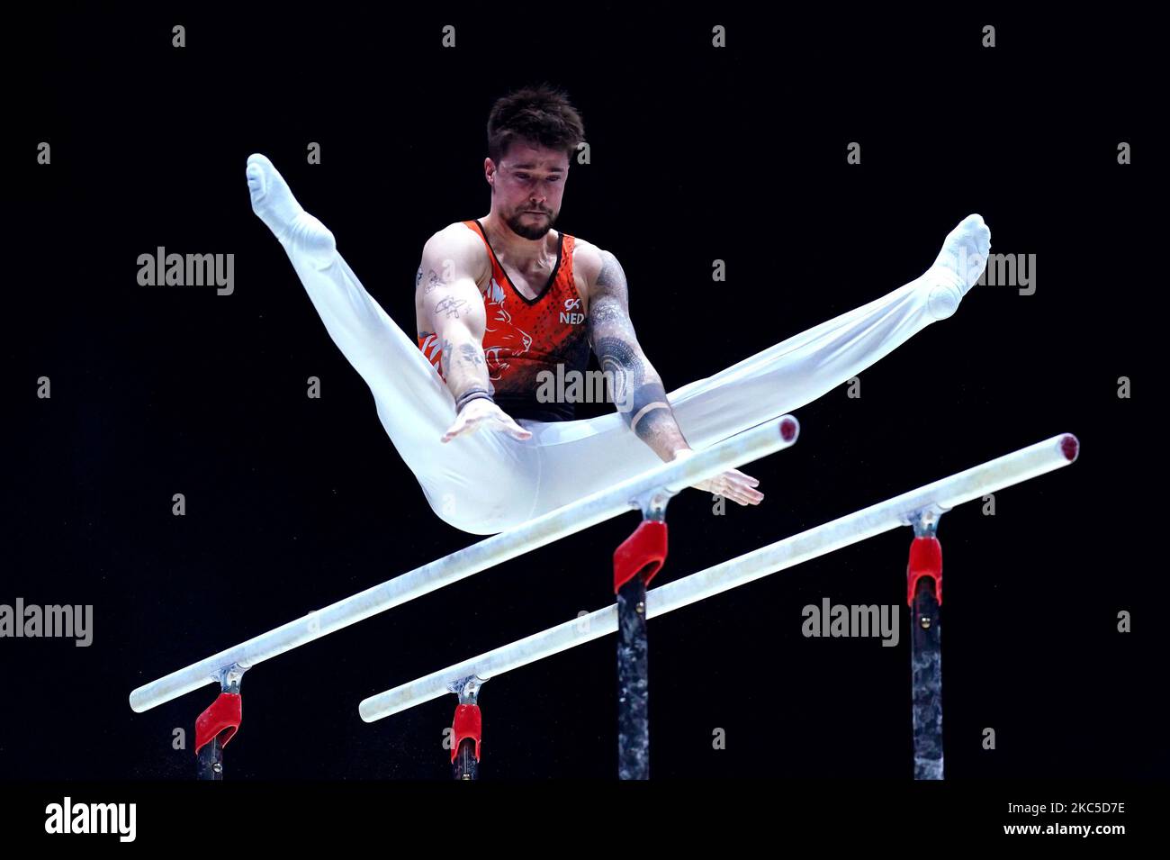 Netherlands' Casimir Schmidt competing in the Men's Parallel Bars event ...