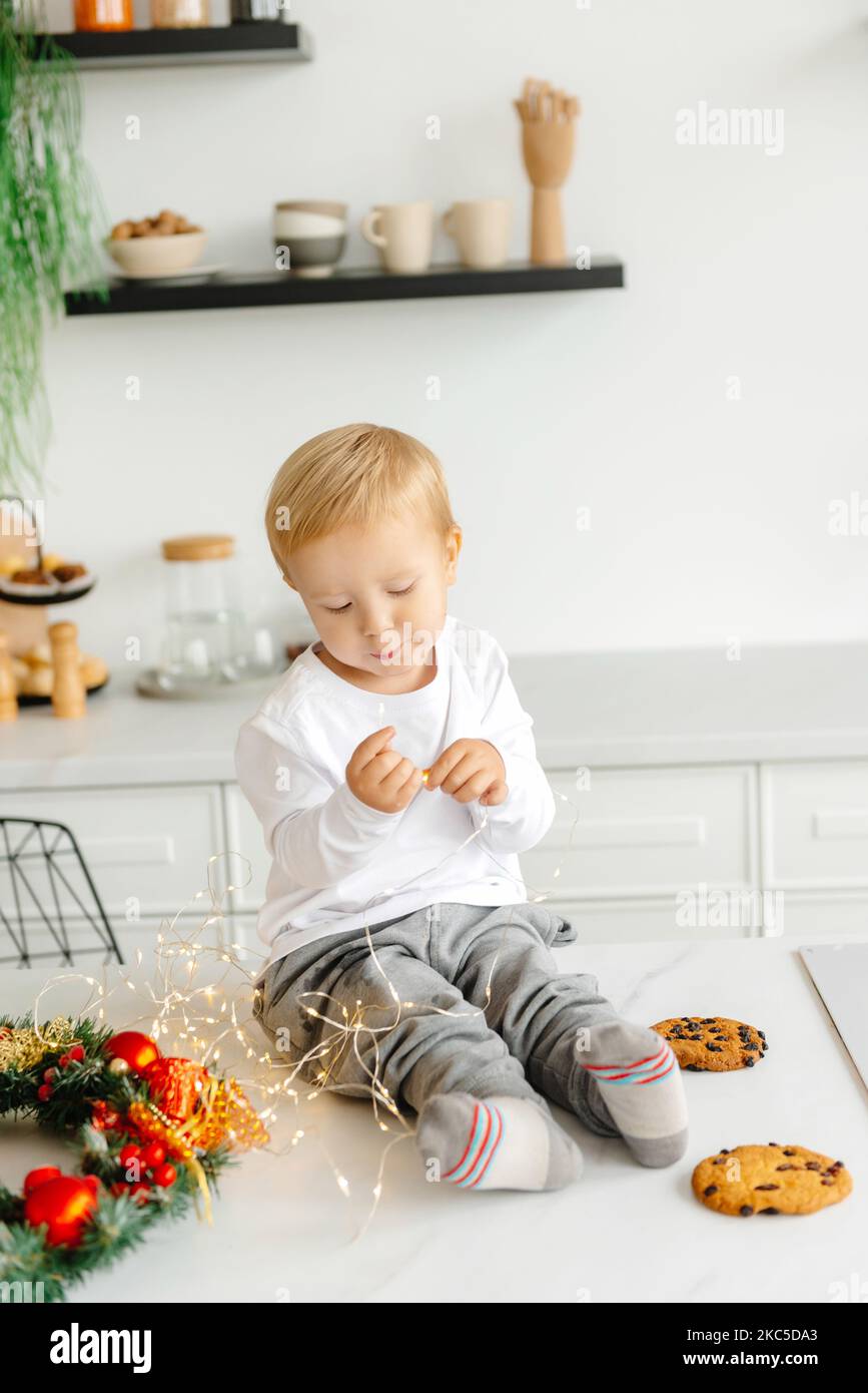 A child playing with Christmas and Christmas lights Stock Photo - Alamy
