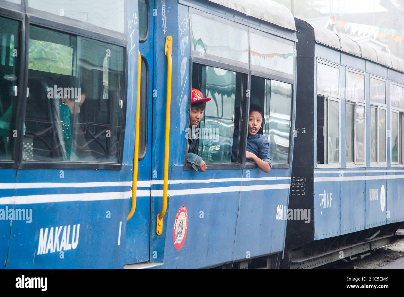Children as seen from the open windows of the train. The Darjeeling ...