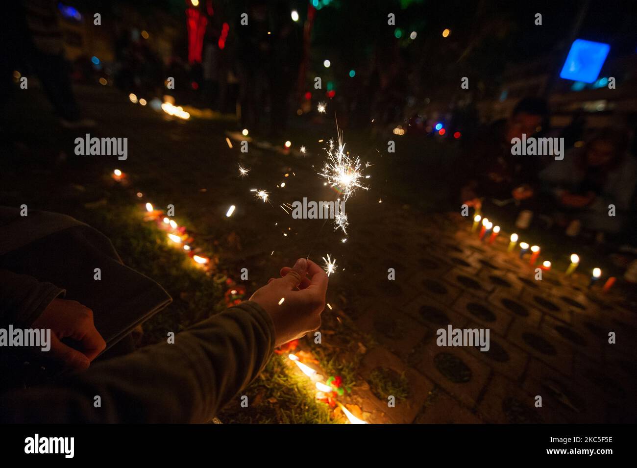 People gather at the Park Way avenue in Bogota to light candles on the ...