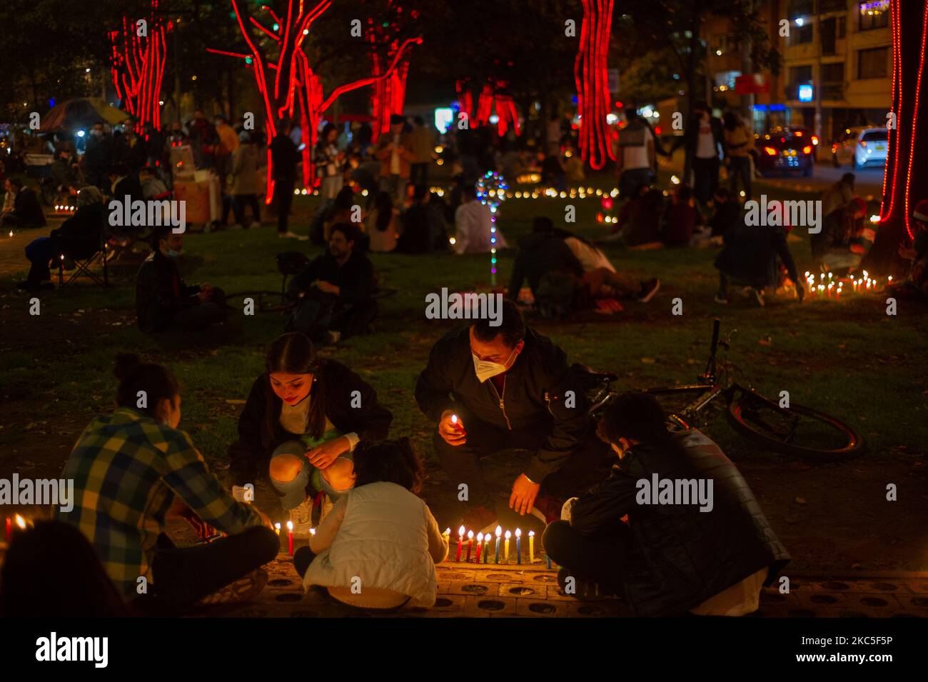 People gather at the Park Way avenue in Bogota to light candles on the ...
