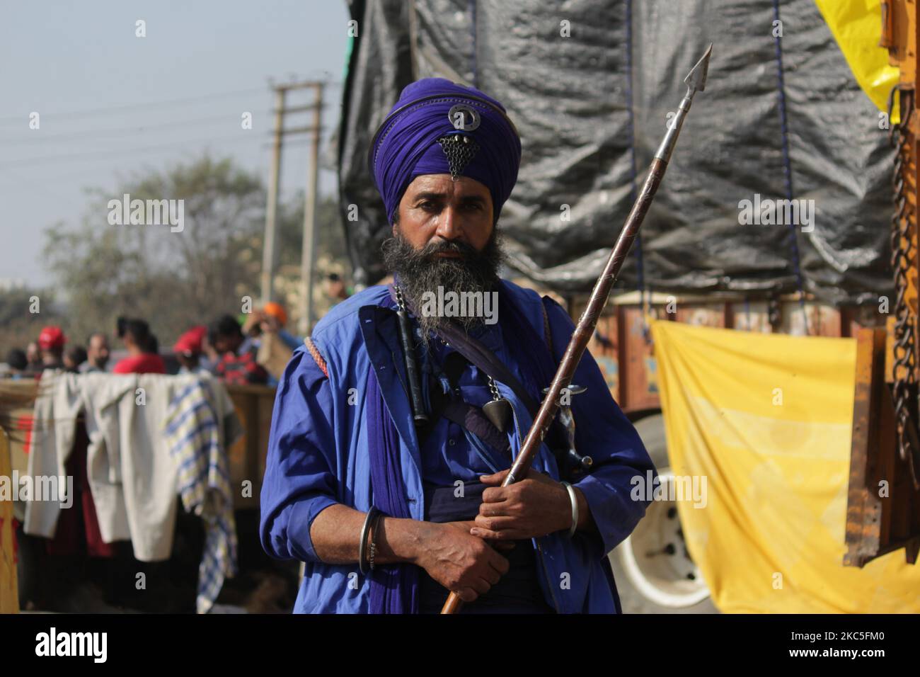 A Nihang (Sikh warrior) poses for an image near the road blockade ...