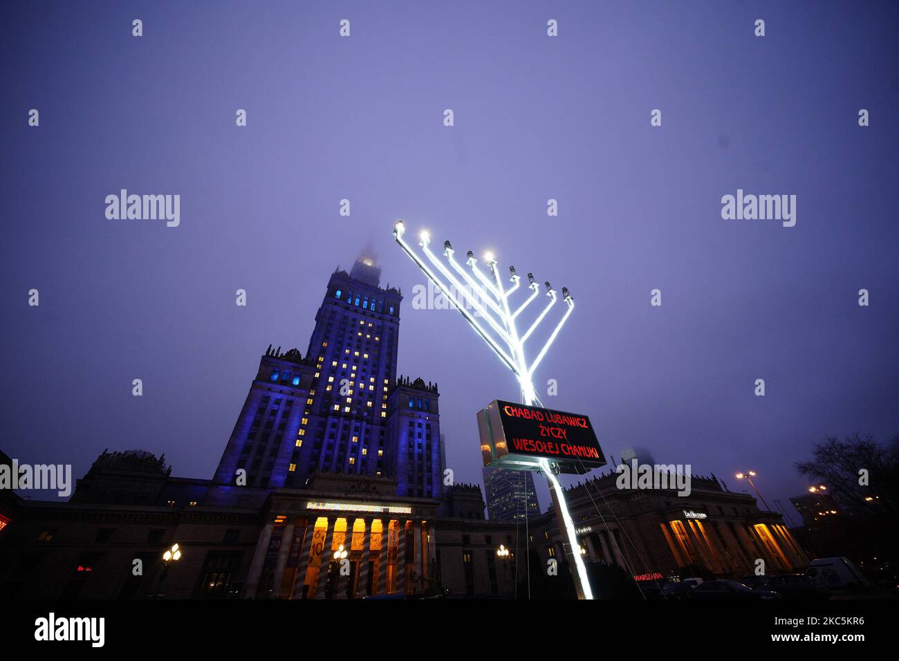 A large menorah is seen in front of the Palace of Culture and Sciences ...