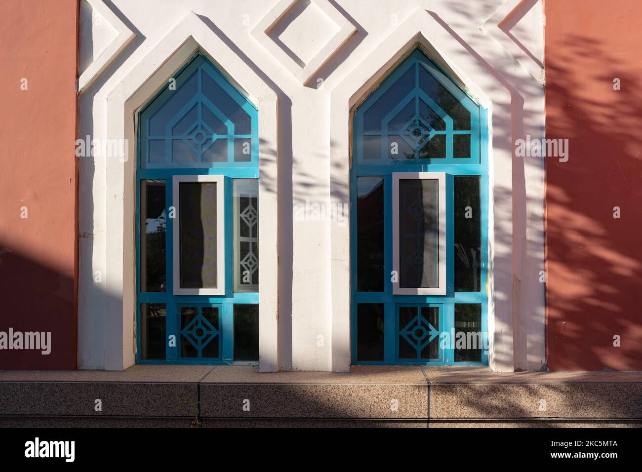 The exterior of a colorful building with wooden windows Stock Photo - Alamy