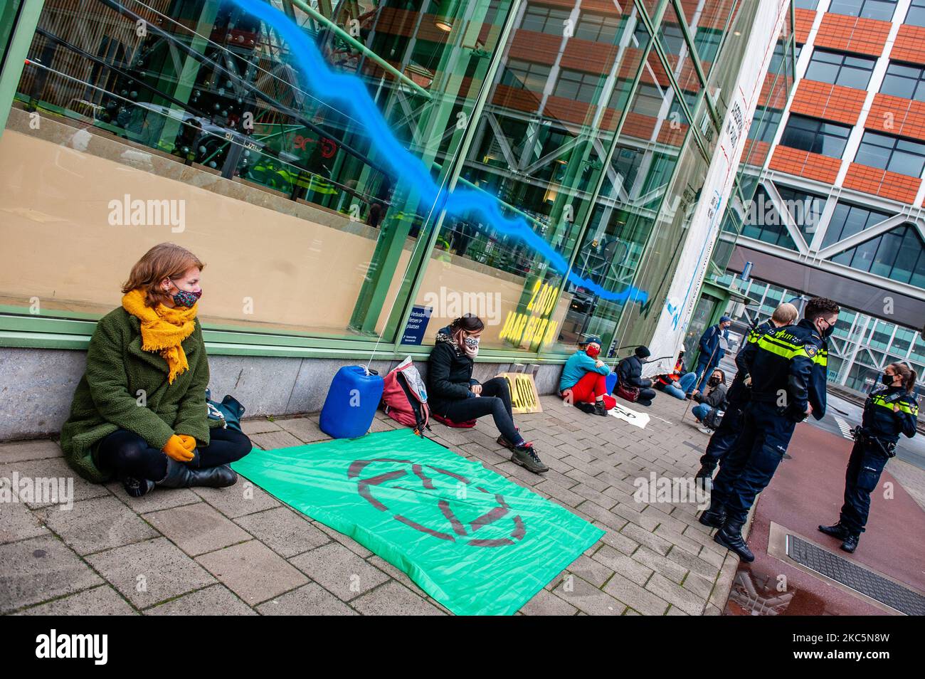 Police Officers Are Surrounded The Climate Activists Sitting In Front