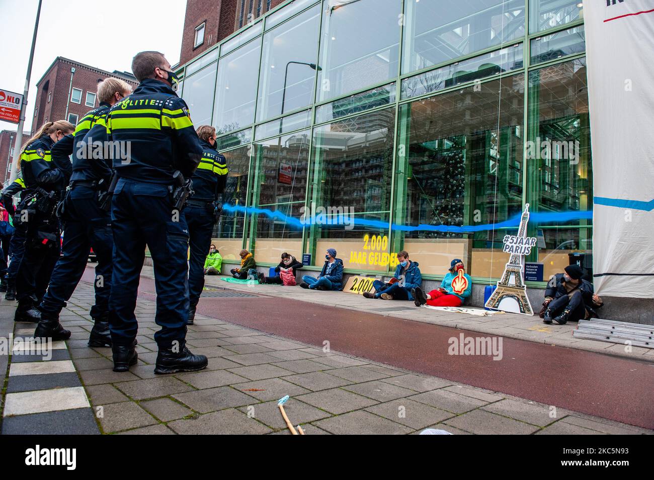 Police Officers Are Surrounded The Climate Activists Sitting In Front