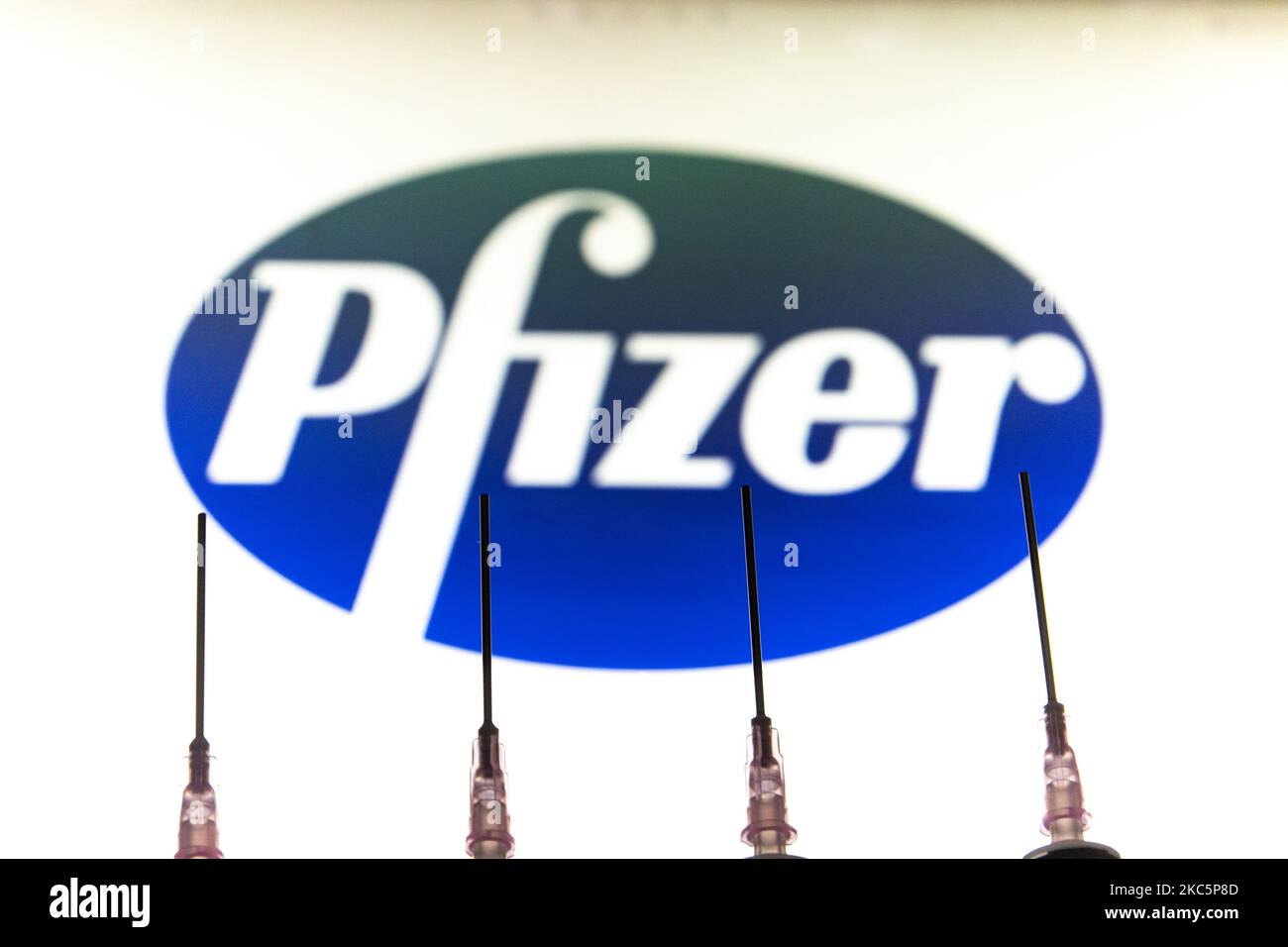 Photo illustration of a medical syringe with a needle seen in front of ...