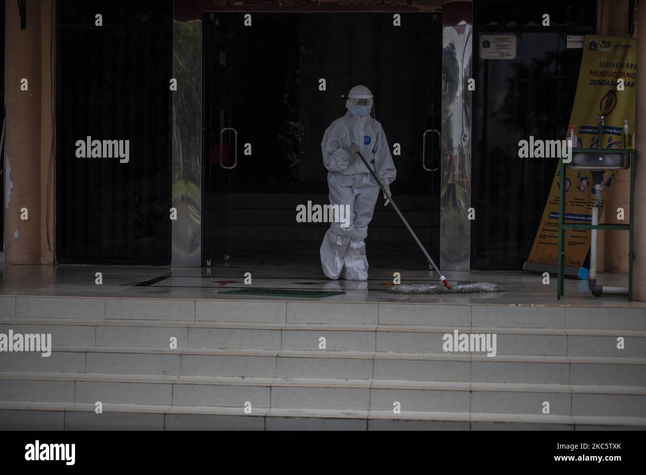 Clean house officer clean the floor of the isolation house with hazmat ...