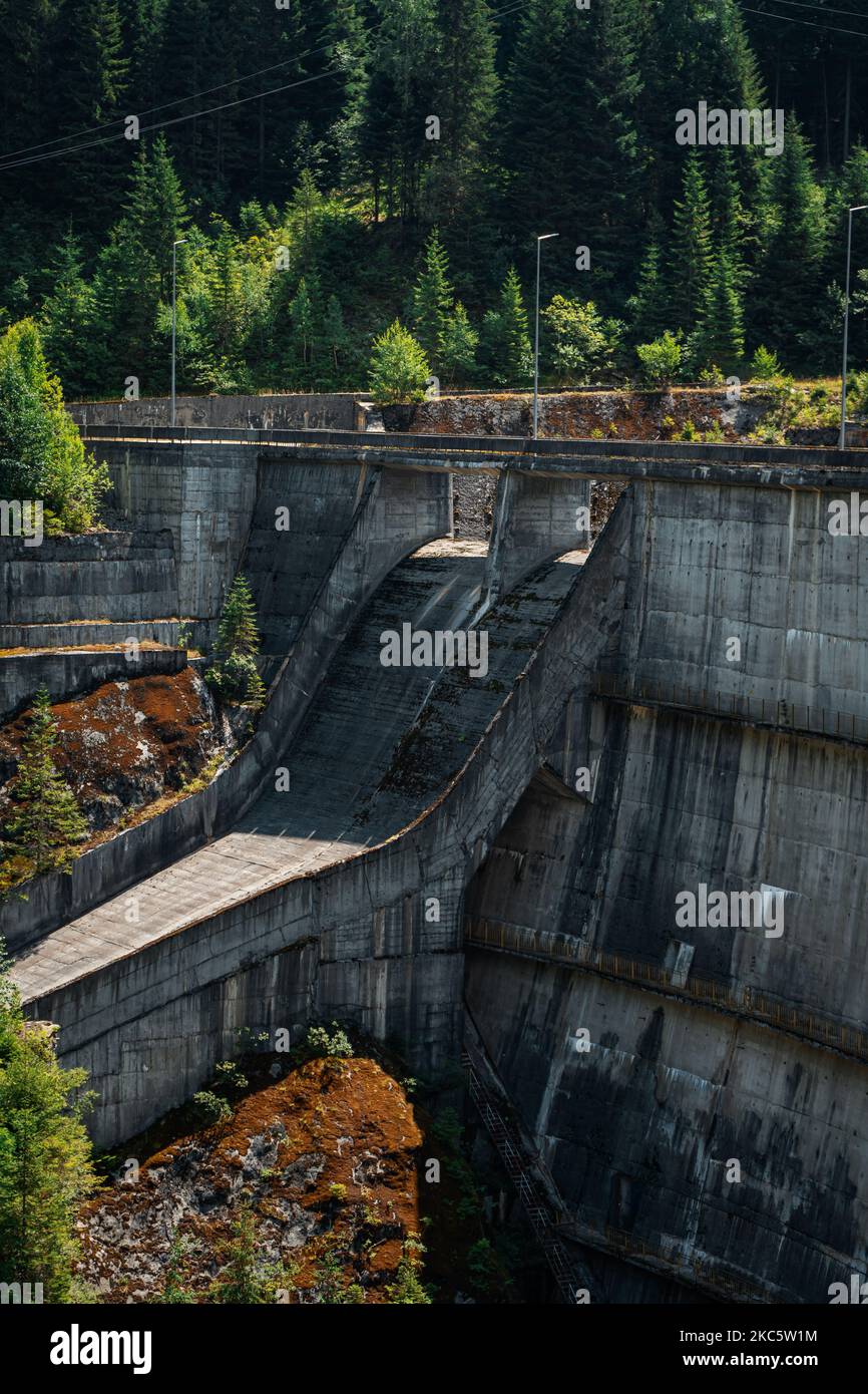 A safety evacuation of the water level of a concrete dam Stock Photo ...