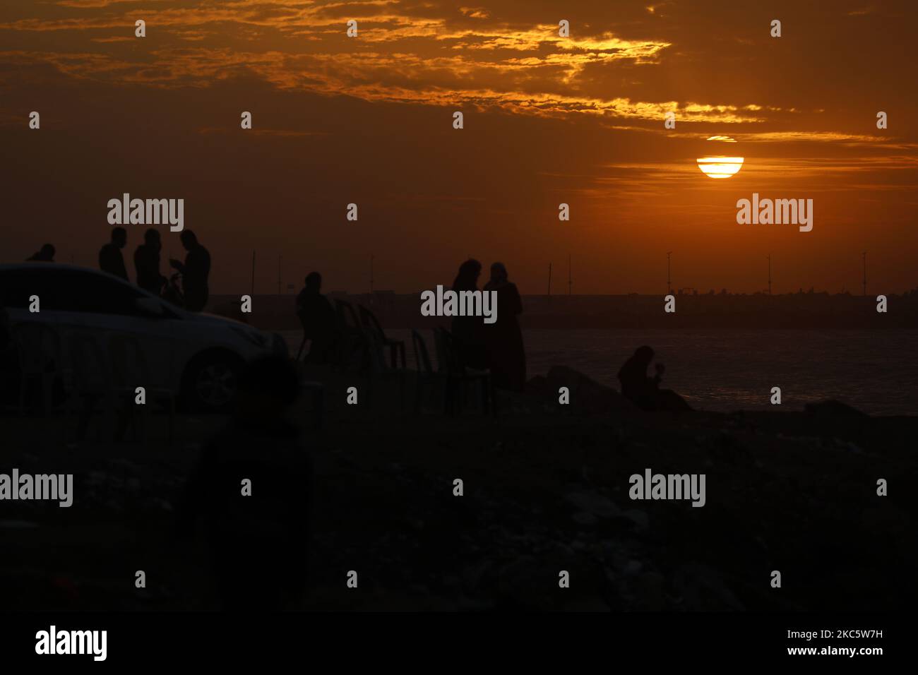 Palestinians enjoy their time during sunset at a beach in Gaza City, 13 ...