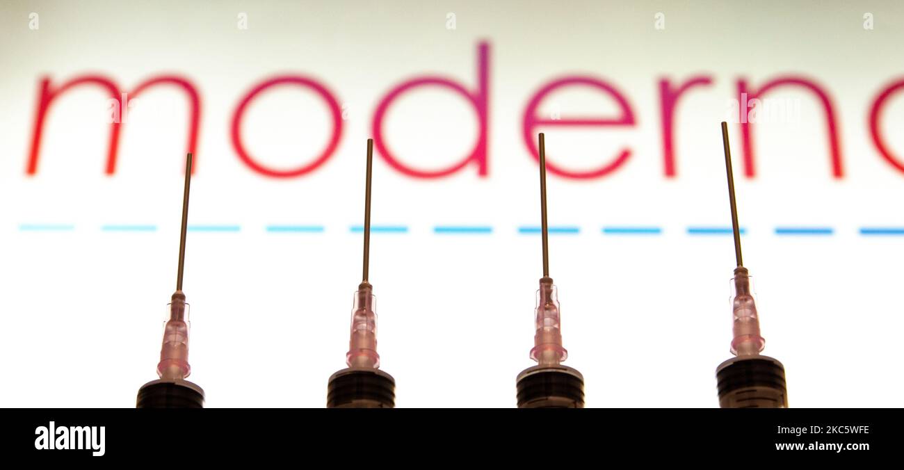 Photo illustration of a medical syringe with a needle seen in front of ...