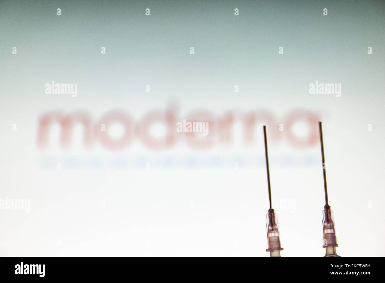 Photo illustration of a medical syringe with a needle seen in front of ...