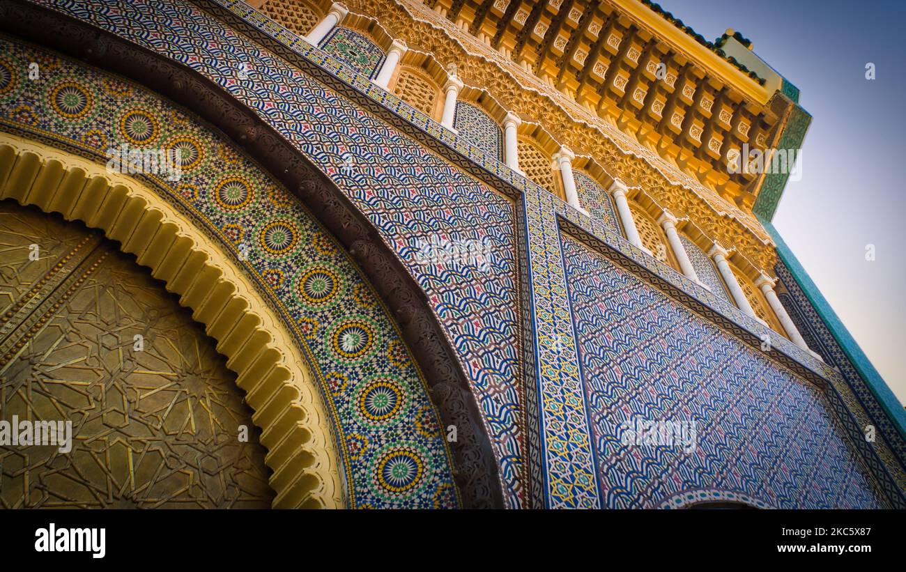 A gorgeous low angle shot of the Fez Royal Palace in Morocco with blue ...
