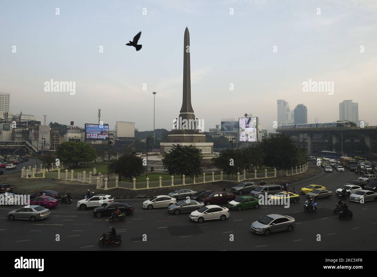 Heavy air pollution of fine particulate matter (PM2.5) shrouds a street ...