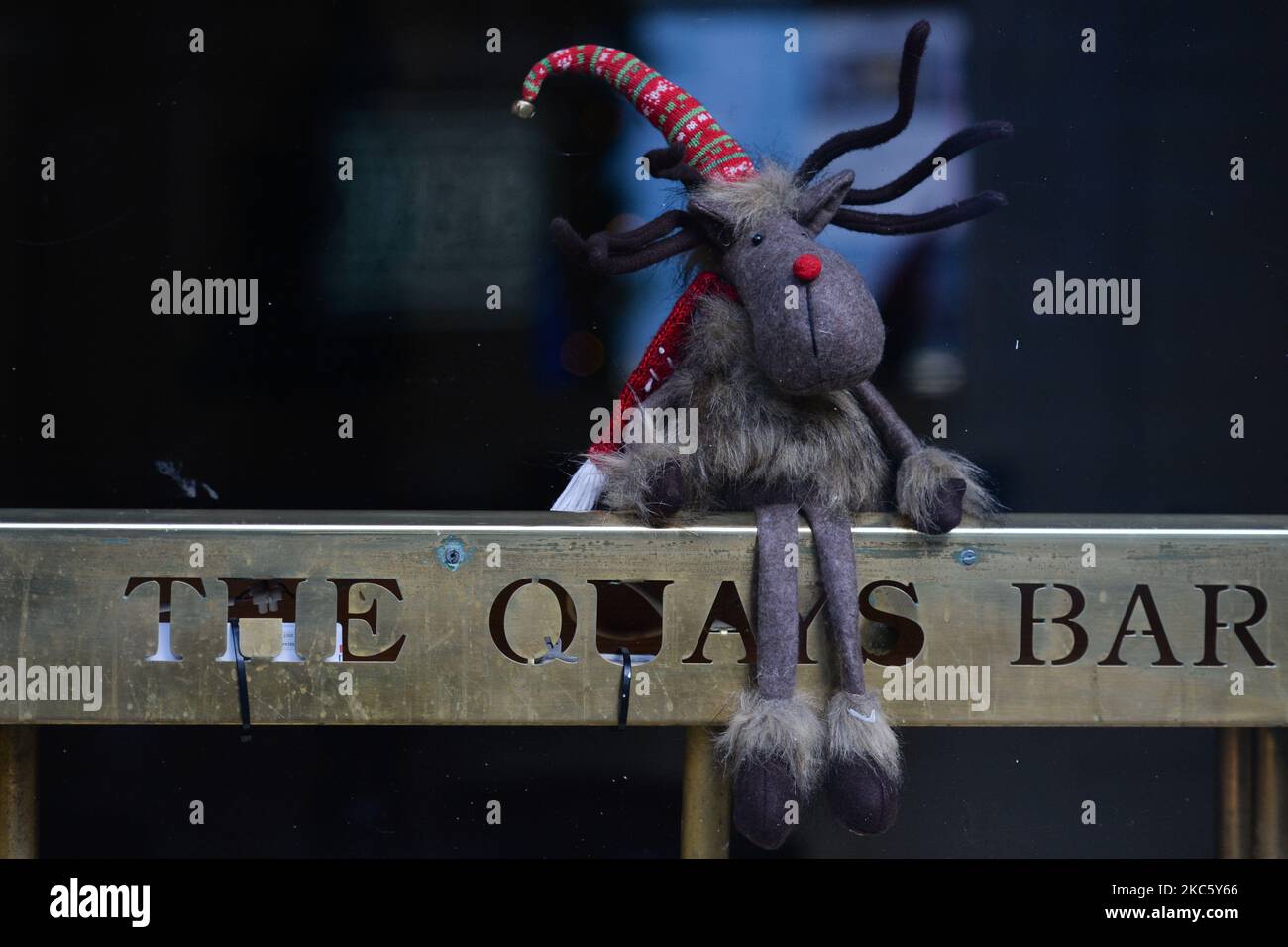 A Christmas Moose seen in a closed The Quays pub window in Dublin's ...