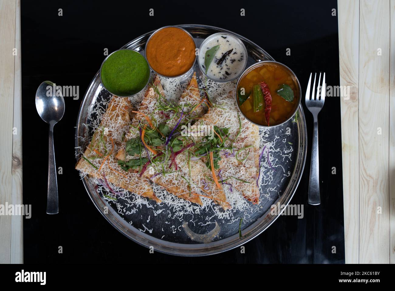A top view of a plate full of delicious Indian Masala Dhosa dish with ...