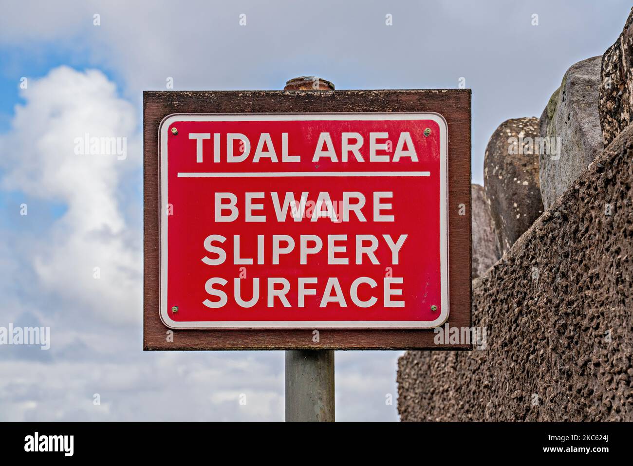 Tidal Area - Beware Slippery Surface Stock Photo - Alamy