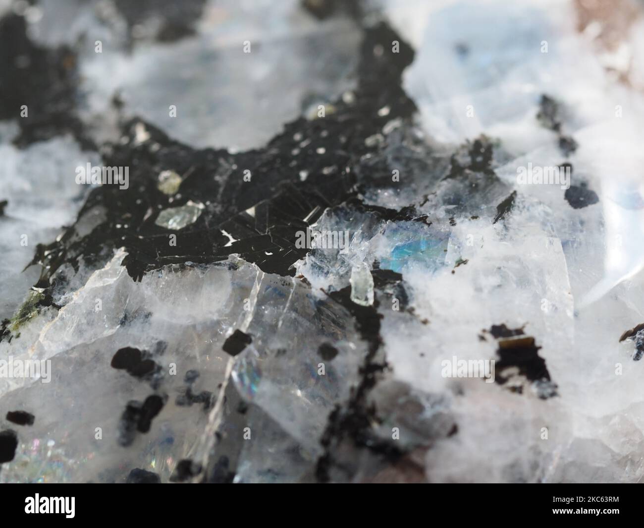 Moonstone with Black and Rainbow Inclusions Stock Photo - Alamy