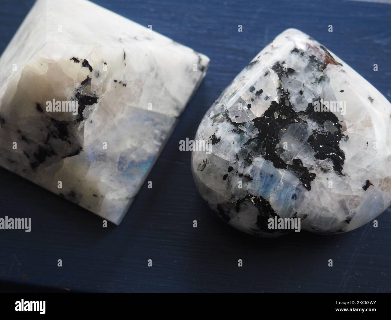 Moonstone with Black and Rainbow Inclusions Stock Photo - Alamy