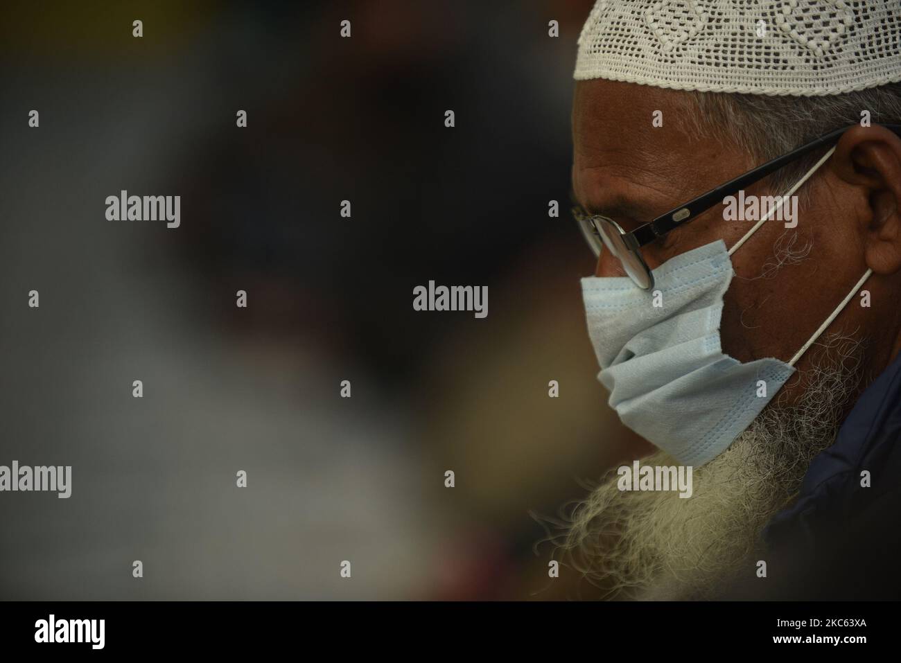 A Nepalese Muslim arrive to offer Friday ritual prayer after nine ...