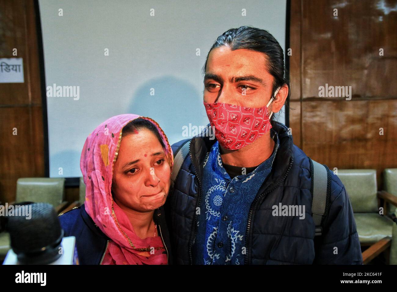 Pakistani Hindu refugee Geeta with her brother reacts after the ...
