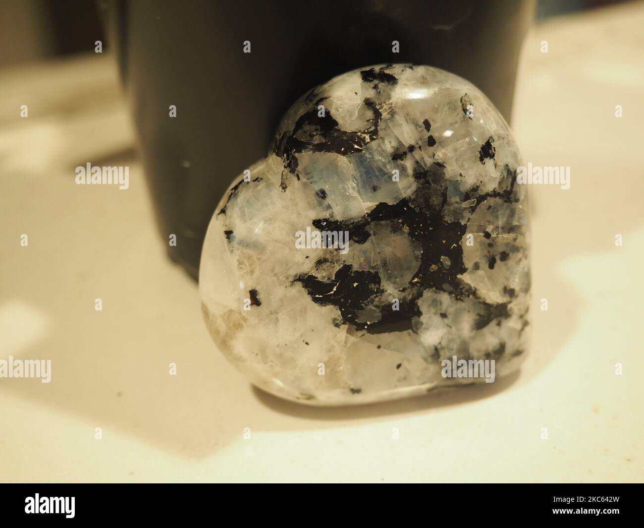 Moonstone with Black and Rainbow Inclusions Stock Photo - Alamy