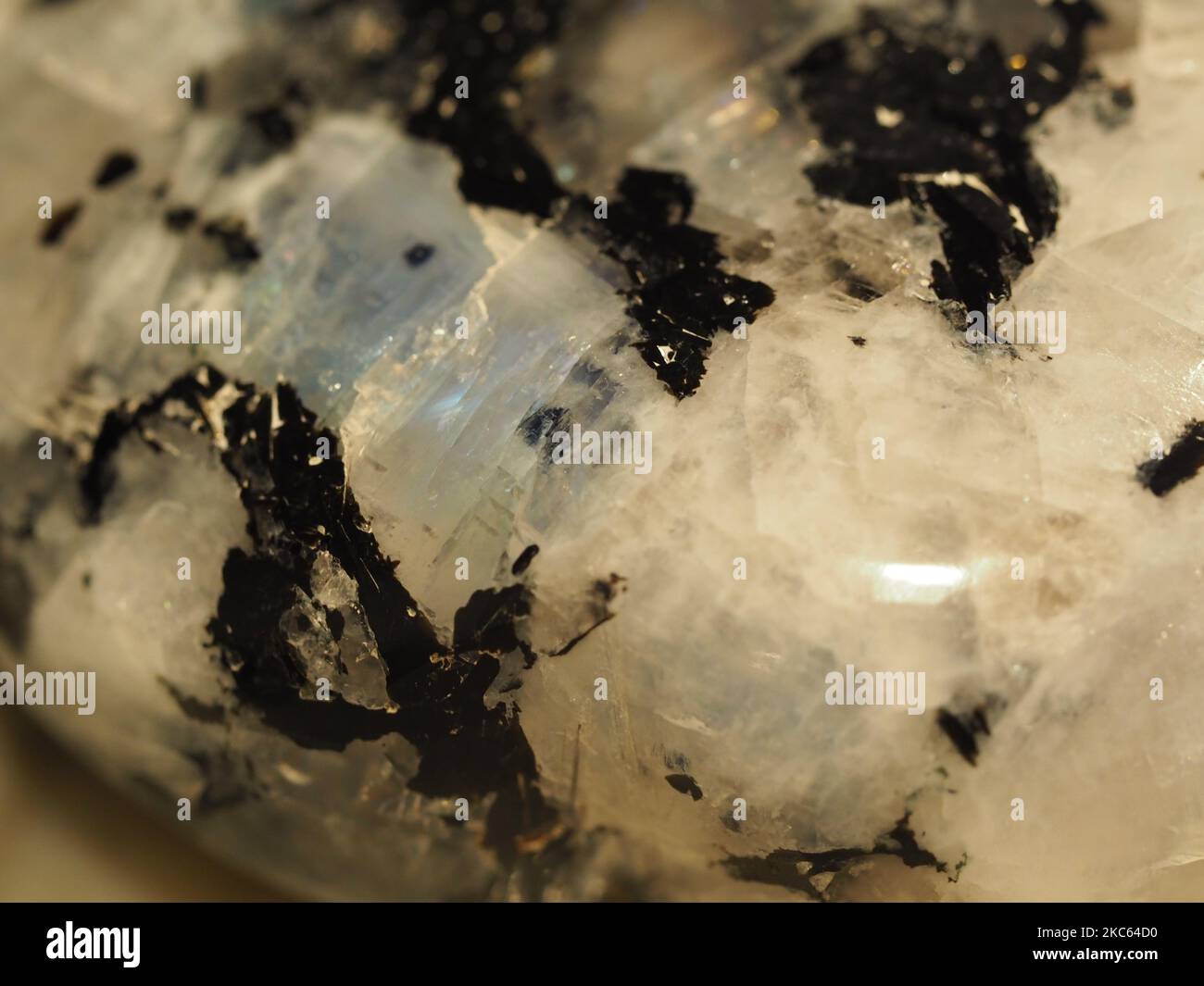 Moonstone with Black and Rainbow Inclusions Stock Photo - Alamy