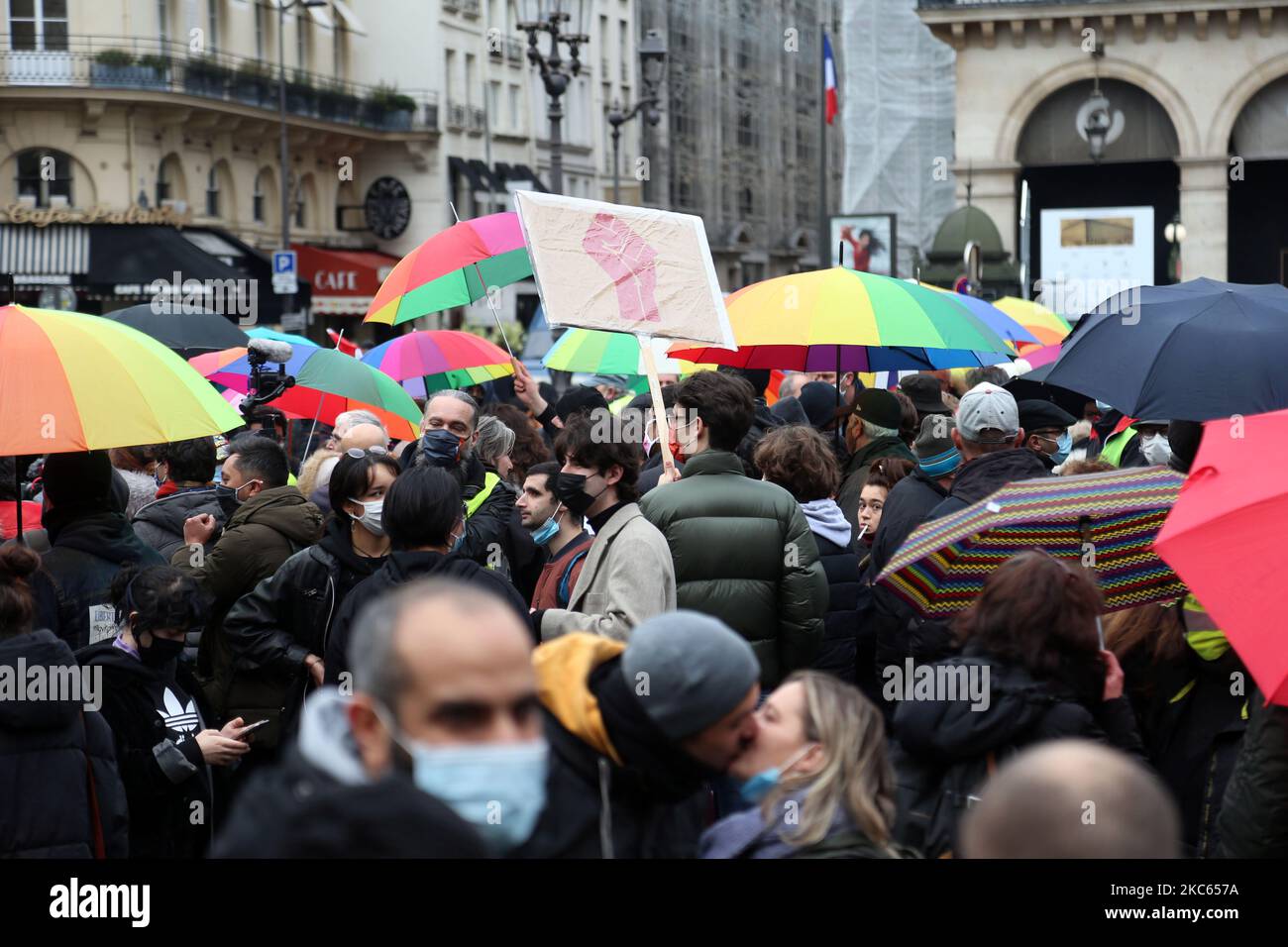 Yellow vests protest with multicolored umbrellas againts the global ...
