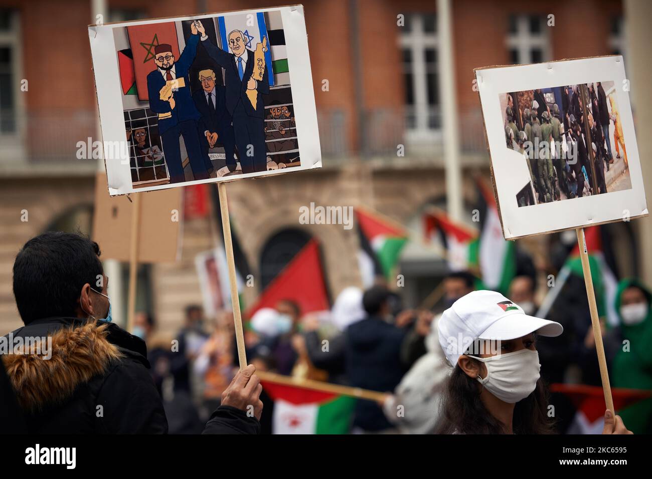 A man holds a drawing depicting the mutual recognition between Israel ...