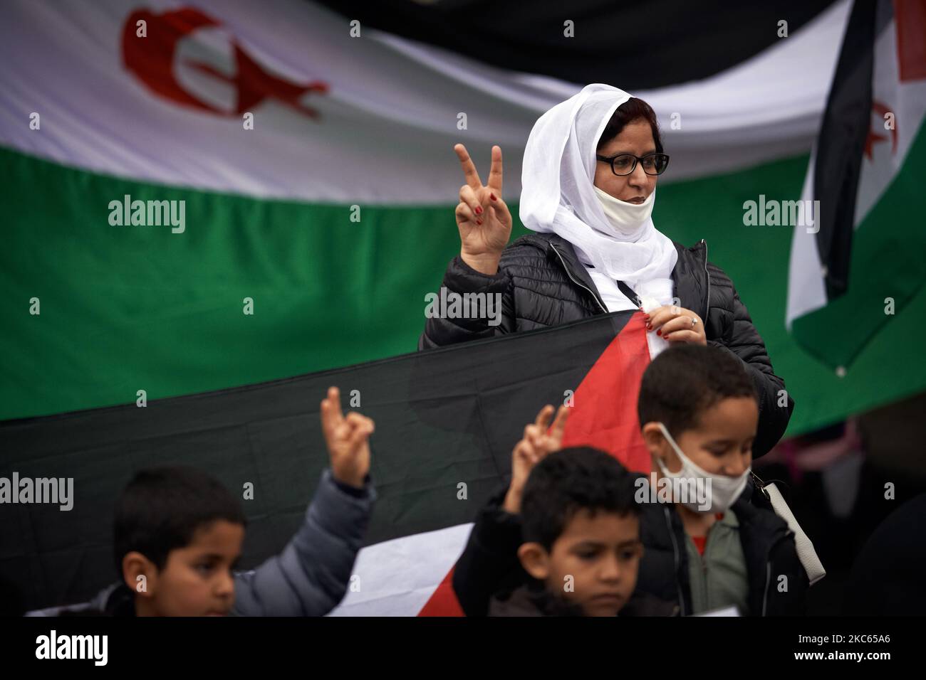 A woman makes the 'V' sign. Sahrawi people of Toulouse gathered against ...