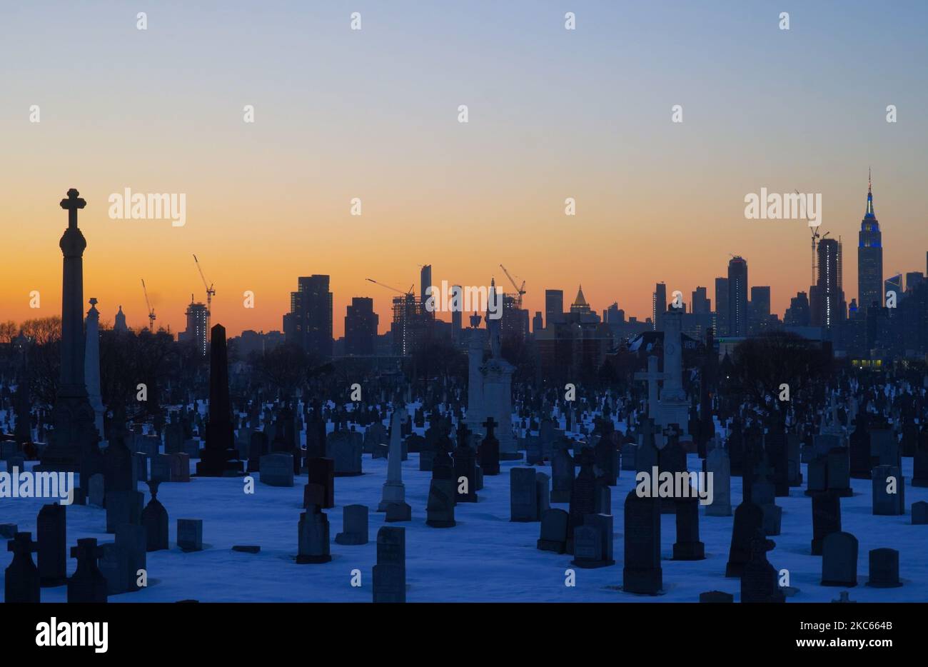 A view of a cemetery is seen during cold weather following snow days in ...