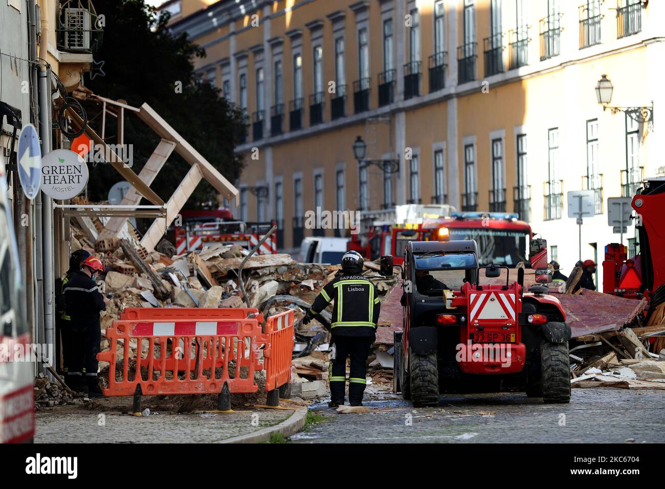 Firefighters, rescue and medical personnel are seen at work on the ...