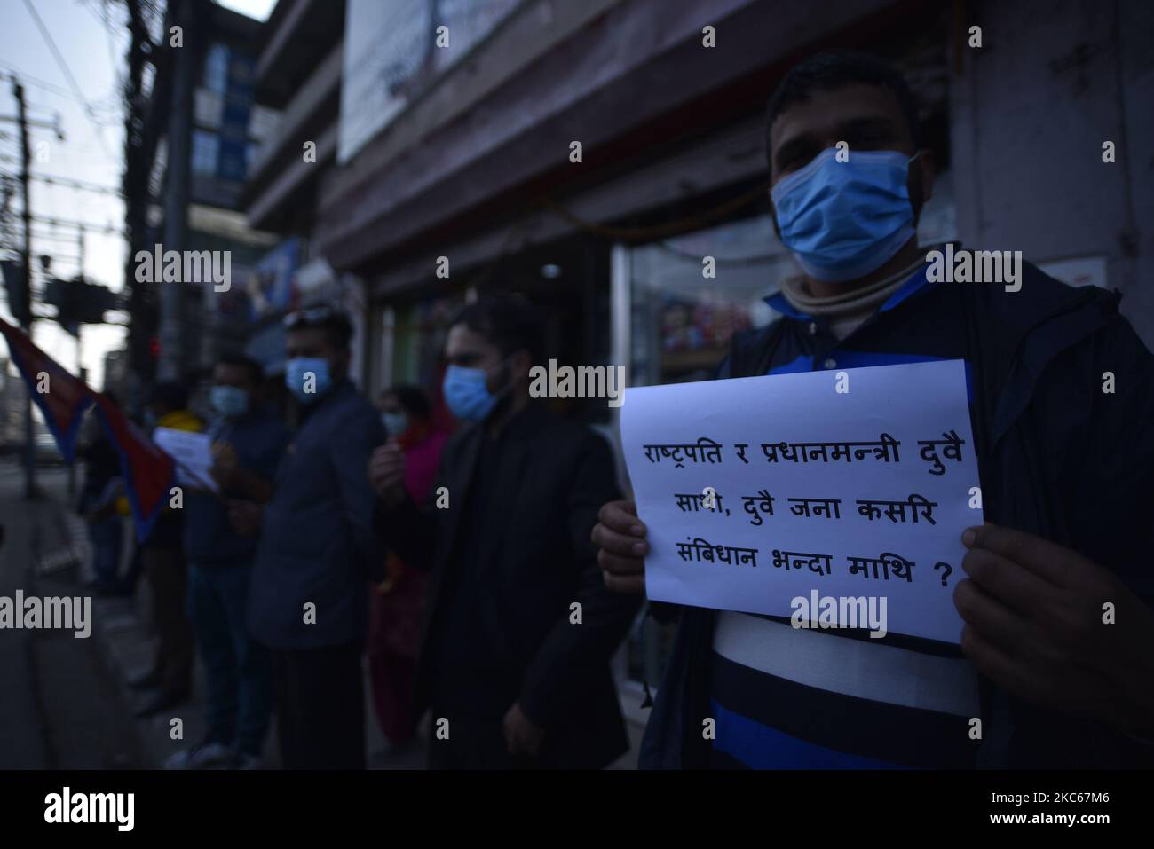 Nepalese people protest holding pla card against controversial move of ...