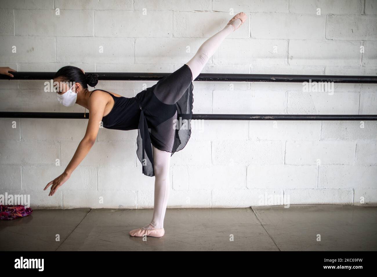 A girl stretching before practicing Ballerina. Balerina course from ...