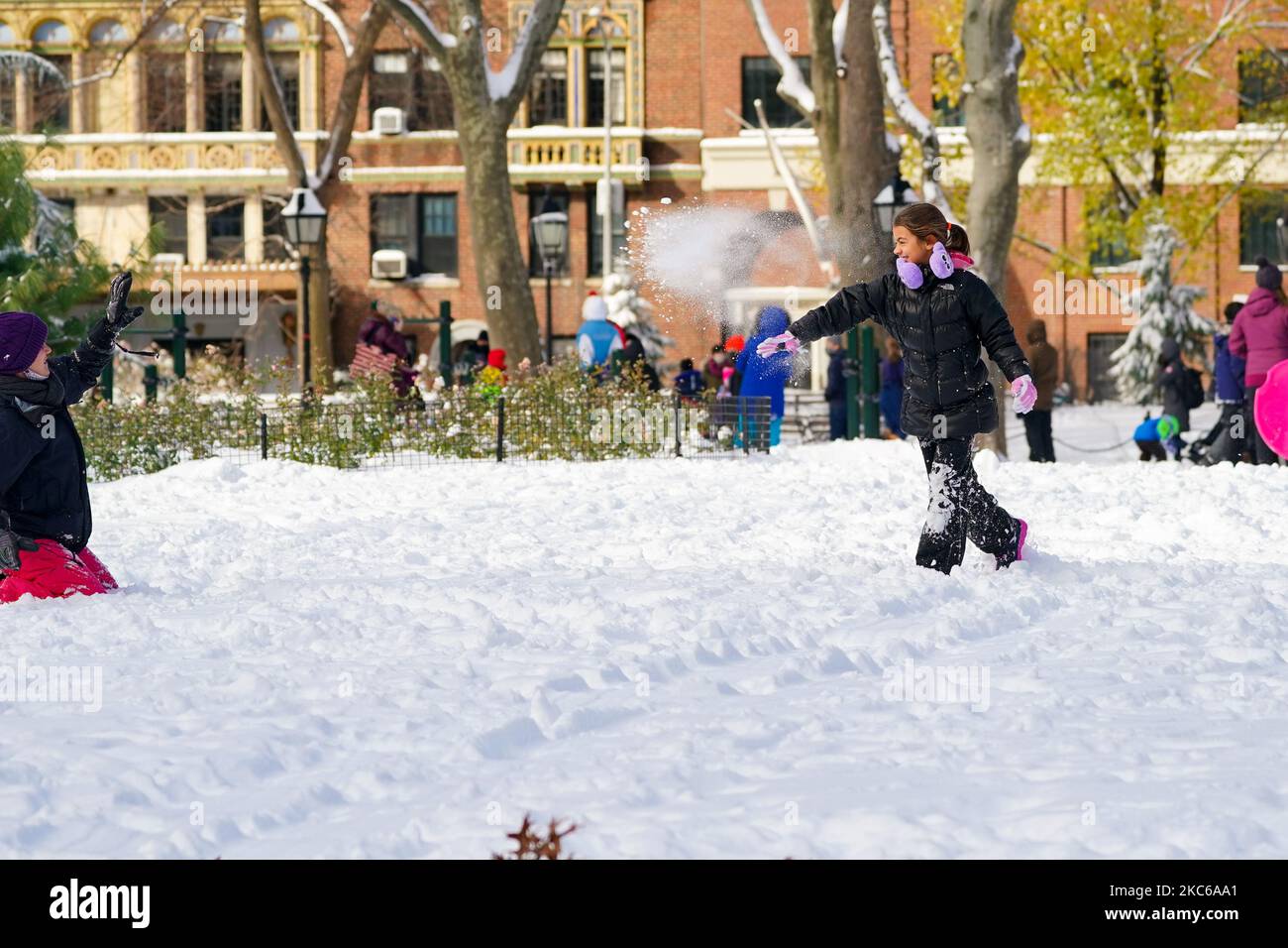 People are seen enjoying the snow in Washington Square Park during a ...