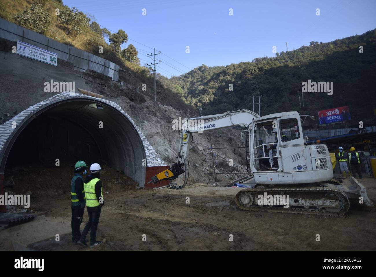 Nepalese workers gestures at the excavation site of Nepal's first road ...