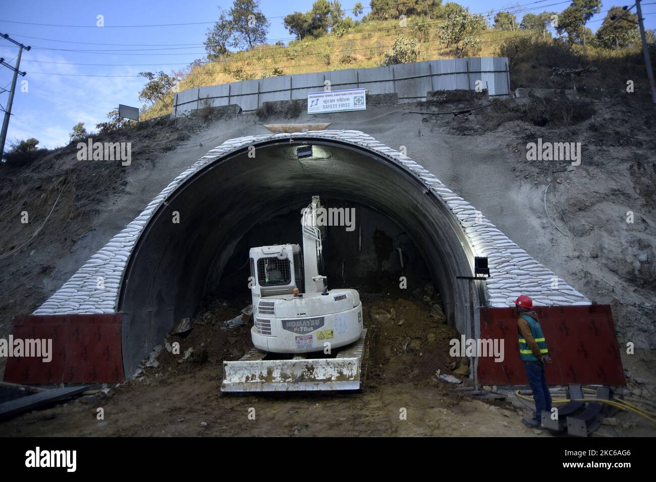 Nepalese workers gestures at the excavation site of Nepal's first road ...